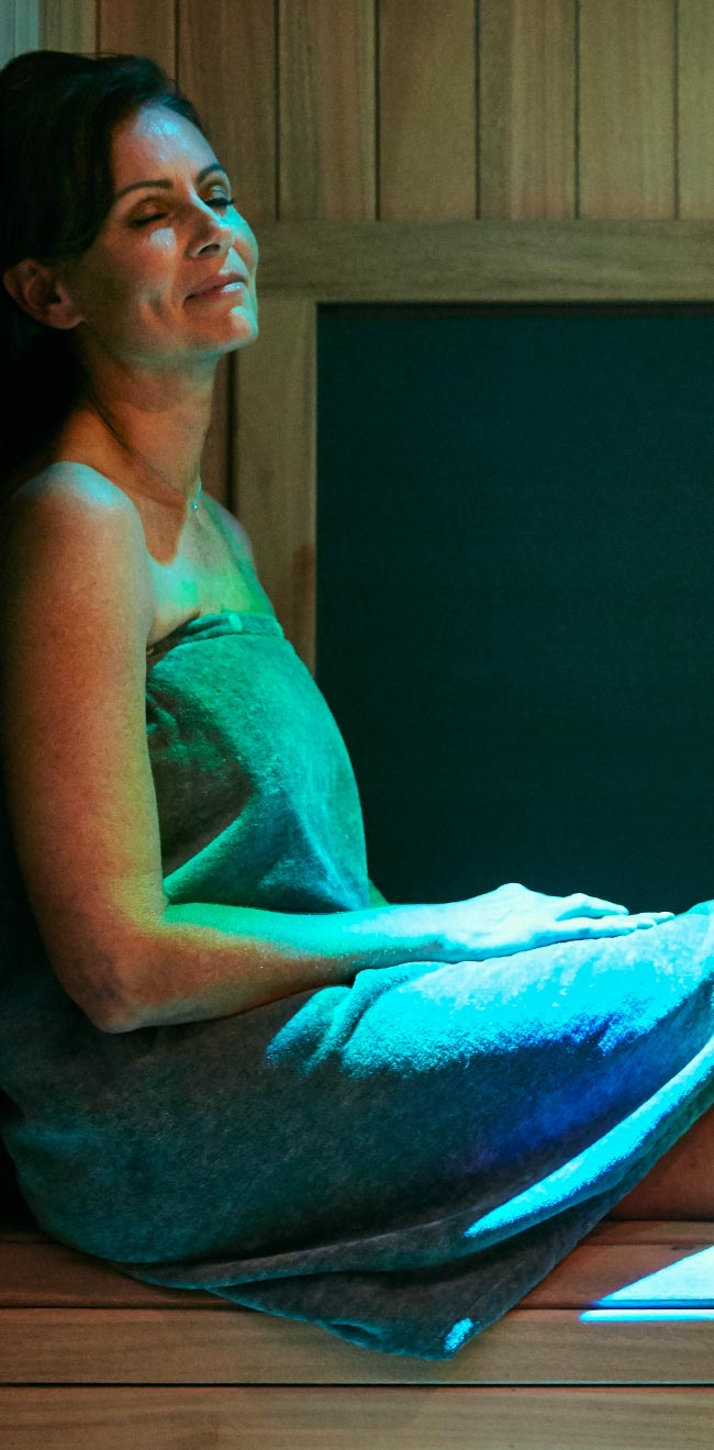 Woman Relaxing in Infrared Sauna - Sunlighten Day Spa